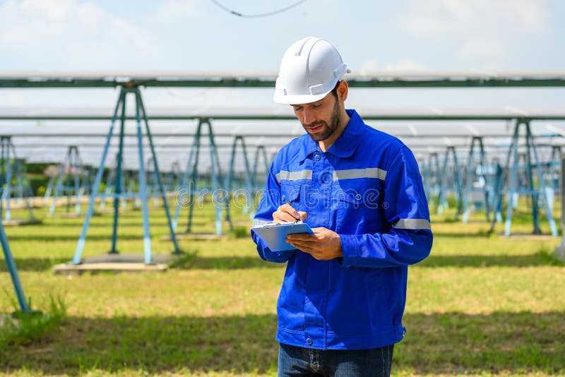 Workers Installing Solar Panels, Engineer Team at Solar Panel Farm ...