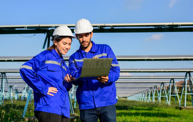 Workers Installing Solar Panels, Engineer Team at Solar Panel Farm ...