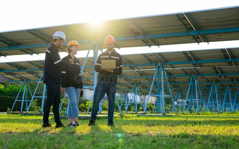 Workers Installing Solar Panels, Engineer Team at Solar Panel Farm ...