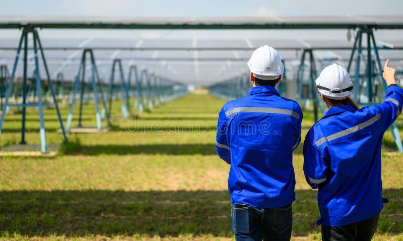 Workers Installing Solar Panels, Engineer Team at Solar Panel Farm ...