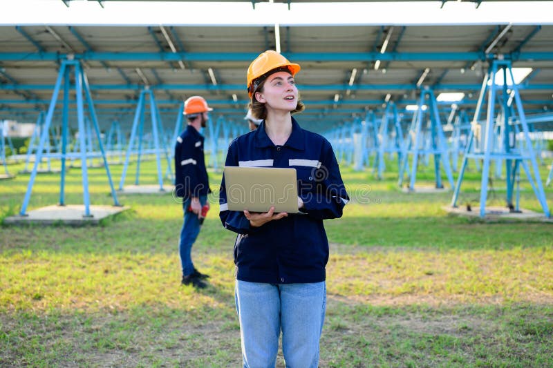 Workers Installing Solar Panels, Engineer Team at Solar Panel Farm ...