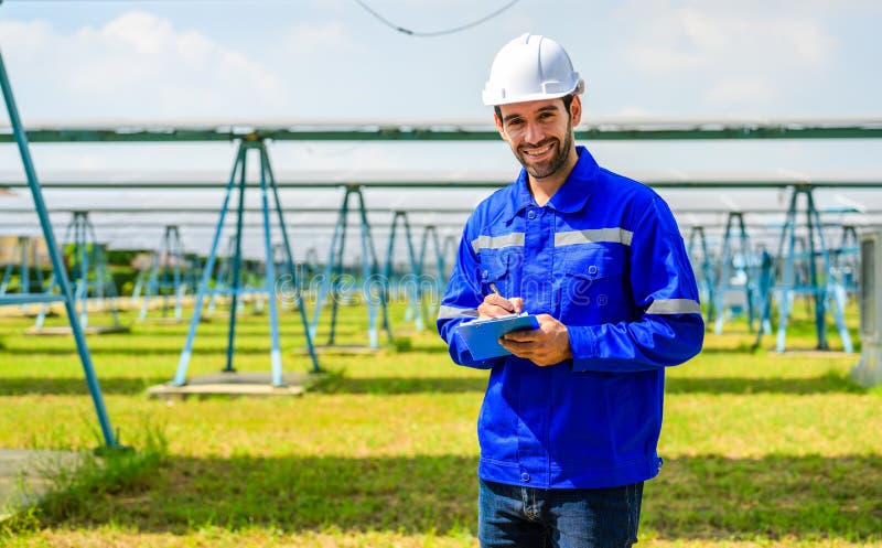 Workers Installing Solar Panels, Engineer Team at Solar Panel Farm ...