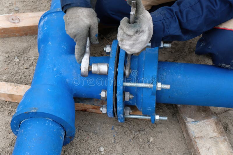 Workers Installing Water Supply Pipeline System, Close Up Stock Photo ...