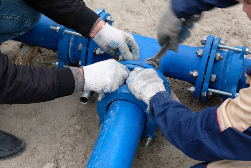 Workers Installing Water Supply Pipeline System, Close Up Stock Image ...