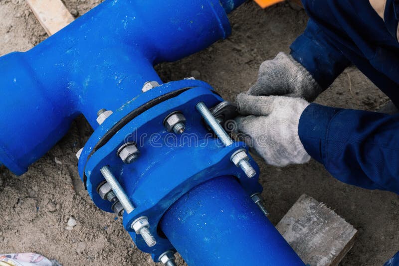 Workers Installing Water Supply Pipeline System, Close Up Stock Photo ...
