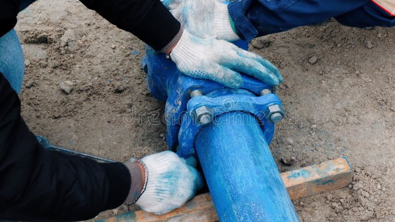 Workers Installing Water Supply Pipeline System, Close Up Stock Footage ...