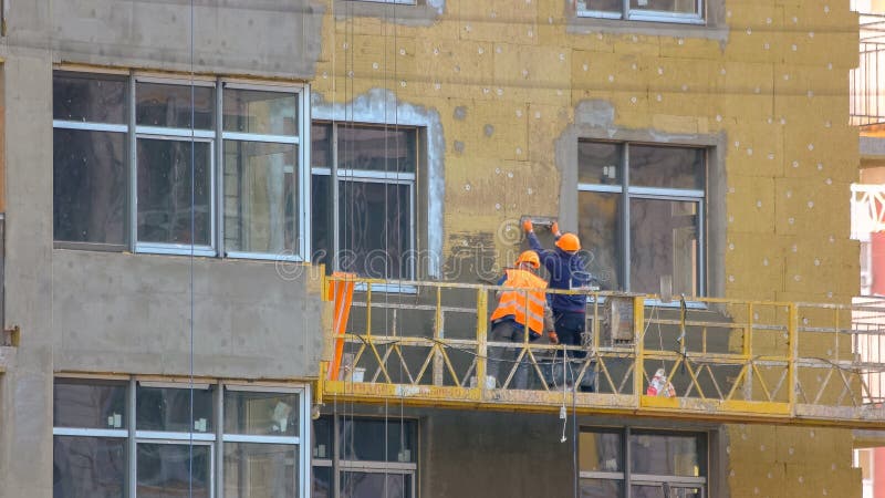Workers are Insulating the Wall of a Building. Editorial Stock Photo ...