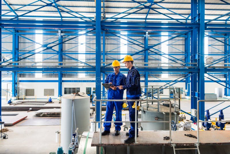 Workers in Large Metal Workshop Checking Work Stock Image - Image of ...