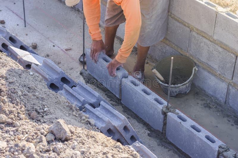 Workers are Laying Blocks of Bricks Stock Photo - Image of level, paver ...