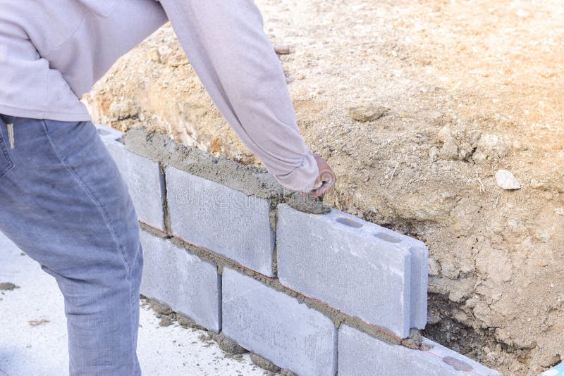Workers are Laying Blocks of Bricks Stock Image - Image of brickwork ...