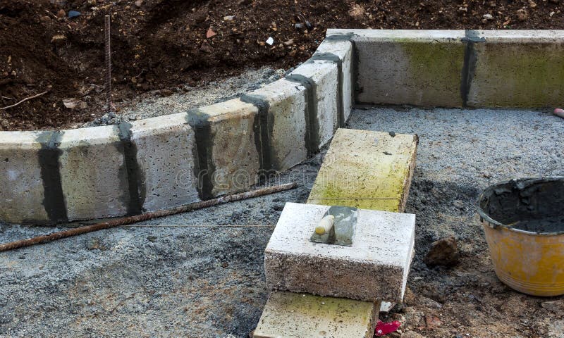 Workers Laying Concrete Curbs Stock Photo - Image of outdoors, cement ...