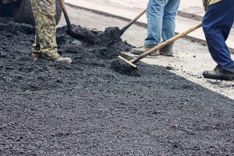 Workers Laying Hot Asphalt on the Road Surface Stock Photo - Image of ...
