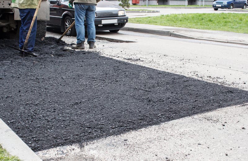 Workers Laying Hot Asphalt on the Road Surface Stock Photo - Image of ...