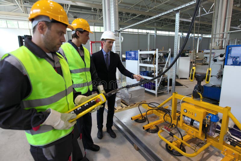Workers and lifting device stock image. Image of technology - 77140613