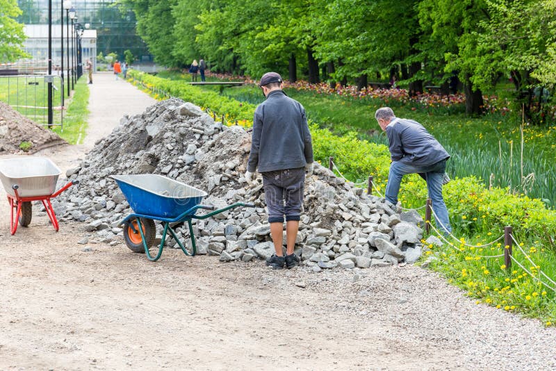 Workers Load the Stones into the Wheelbarrow Editorial Photography ...