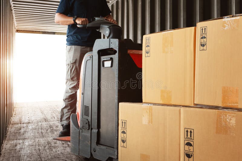 Workers Loading a Package Boxes Inside Shipping Cargo Container. Supply ...