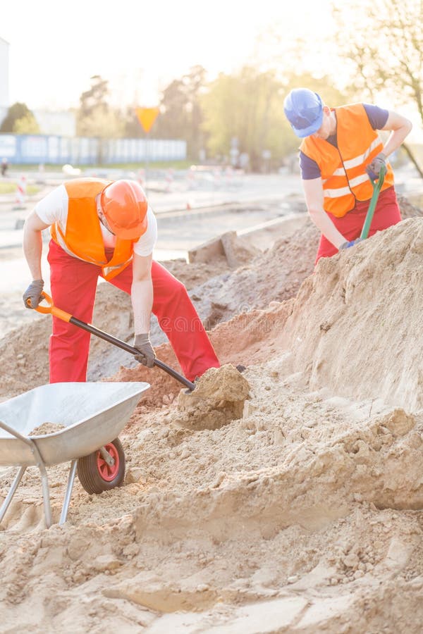 Workers loading the sand stock image. Image of orange - 72768053