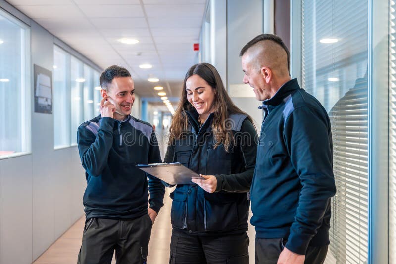 Workers of a Logistic Factory Talking in a Corridor Stock Photo - Image ...