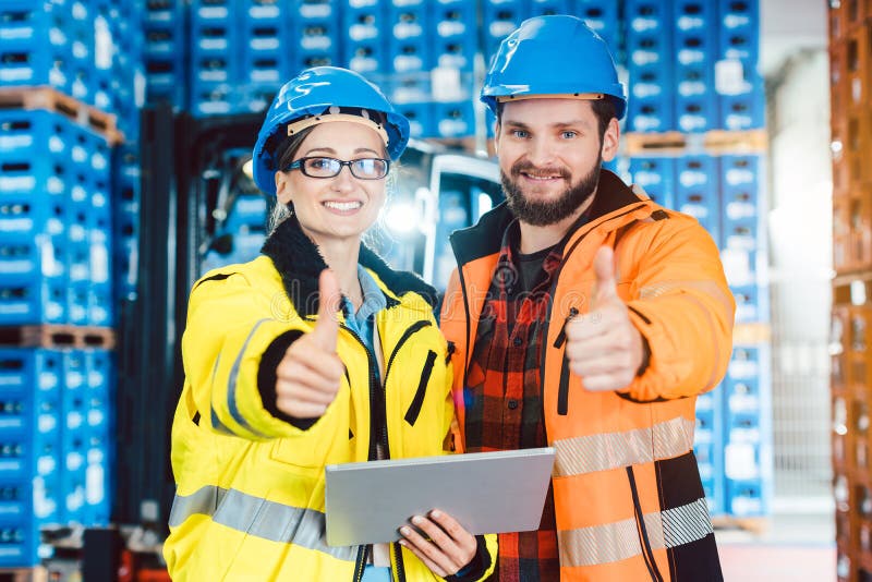 Workers in Logistics Distribution Center Showing Thumbs-up Stock Photo ...