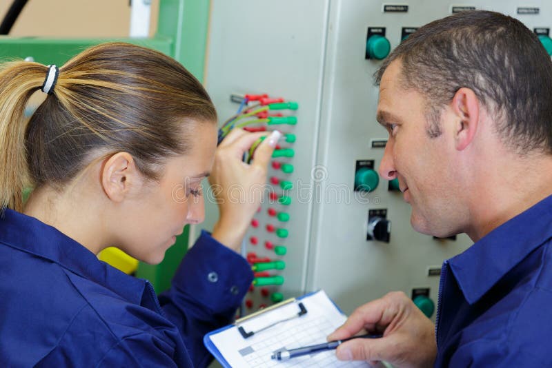 Workers Looking and Checking Electricity Control Panel Stock Photo ...