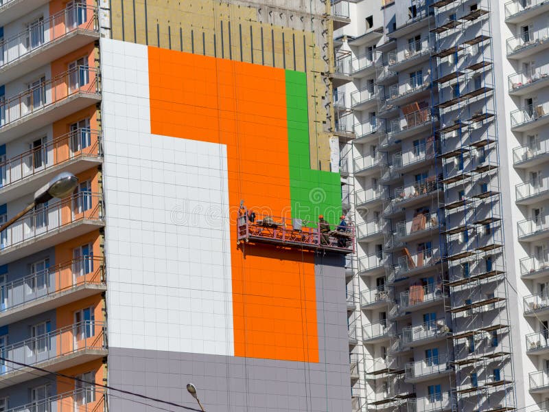 Workers Make Color Cladding on the Wall of a New Residential Building ...