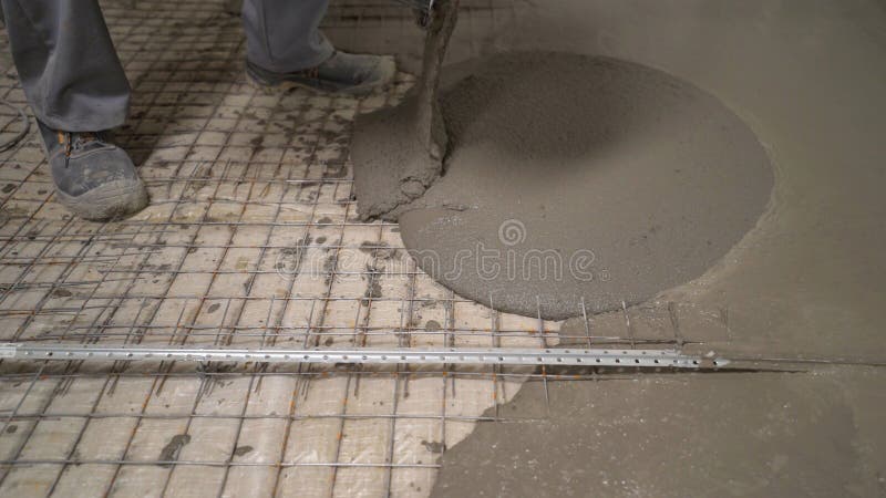 Professional Floor Screed. Workers Pour Mortar Onto the Floor To Level ...