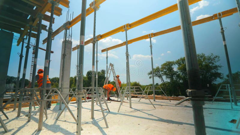 Workers are Making a Base for Metal Structures. Building Construction ...