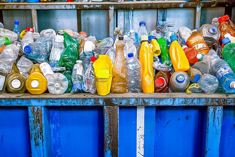 Workers Manage Recycling Efforts As they Sort through Plastic Bottles ...