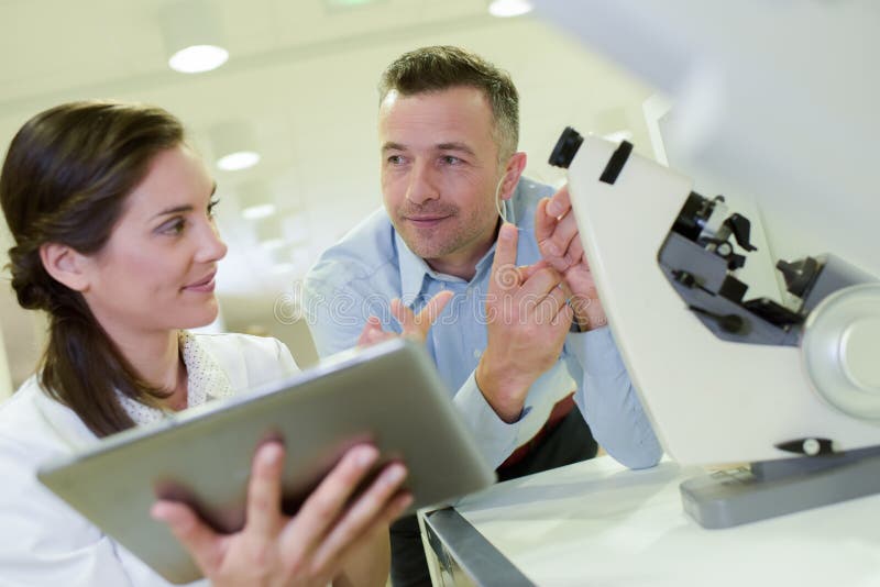 Workers Manufacturing Spectacle Lenses in Laboratory Stock Image ...