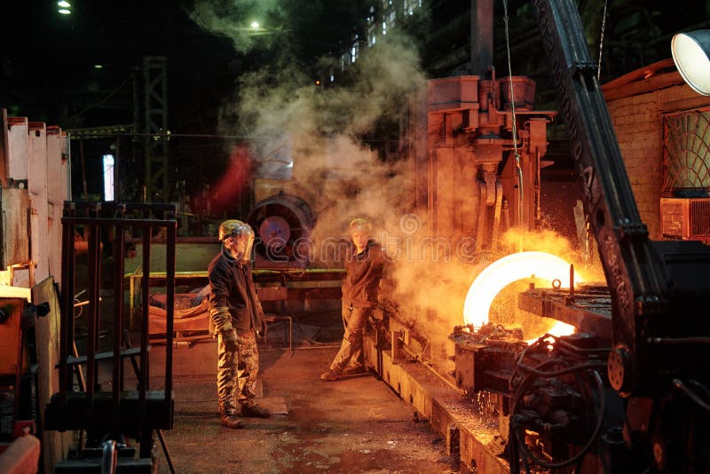 Steel workers in factory stock photo. Image of concentration - 208605252
