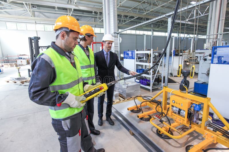 Workers with Metal Sheet Lifting Device Stock Image - Image of ...