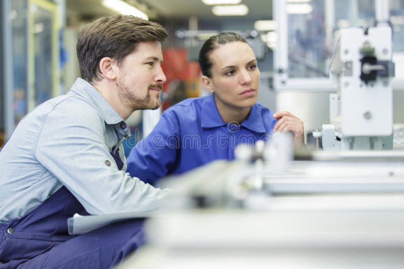 Workers in Metal Workshop Man and Woman Stock Photo - Image of ...