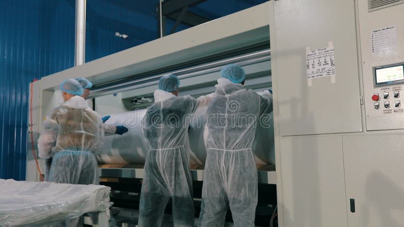 Workers in a Modern Factory. People Perform Work in the Workshop of a ...