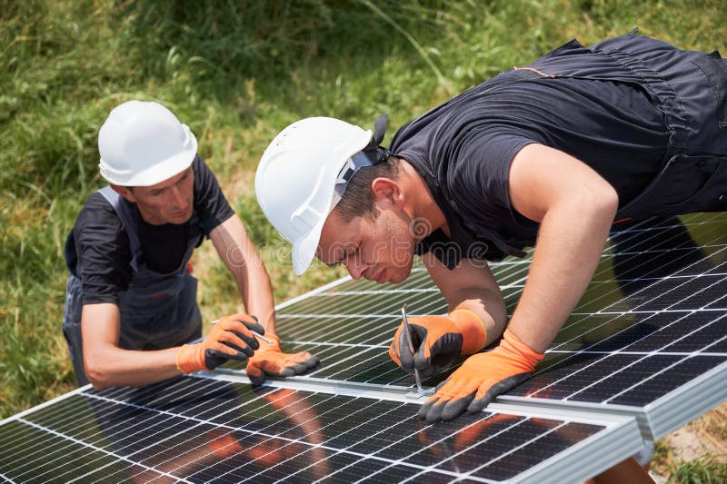 Workers Mounting Photovoltaic Solar Panel System Stock Photo - Image of ...