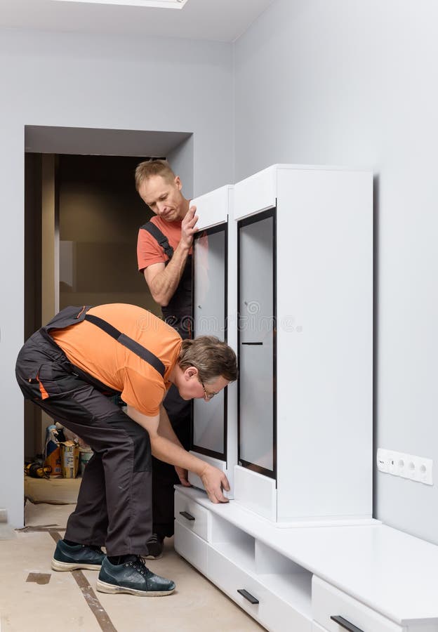 Workers Move and Install Furniture Stock Image - Image of carrying ...