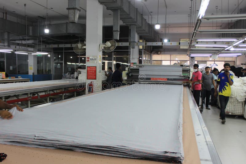 Workers Operating Textile Manufacturing Machines in a Modern Factory ...