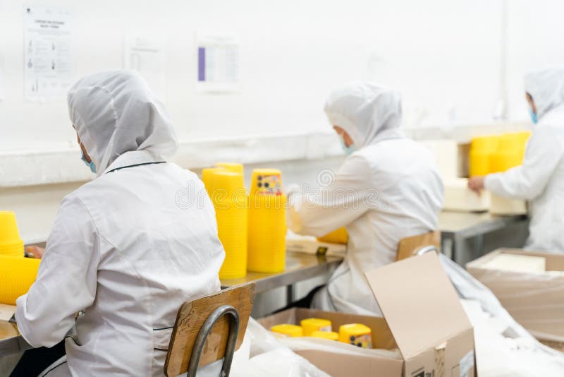 Workers Packaging Yellow Containers at Industrial Factory Editorial ...