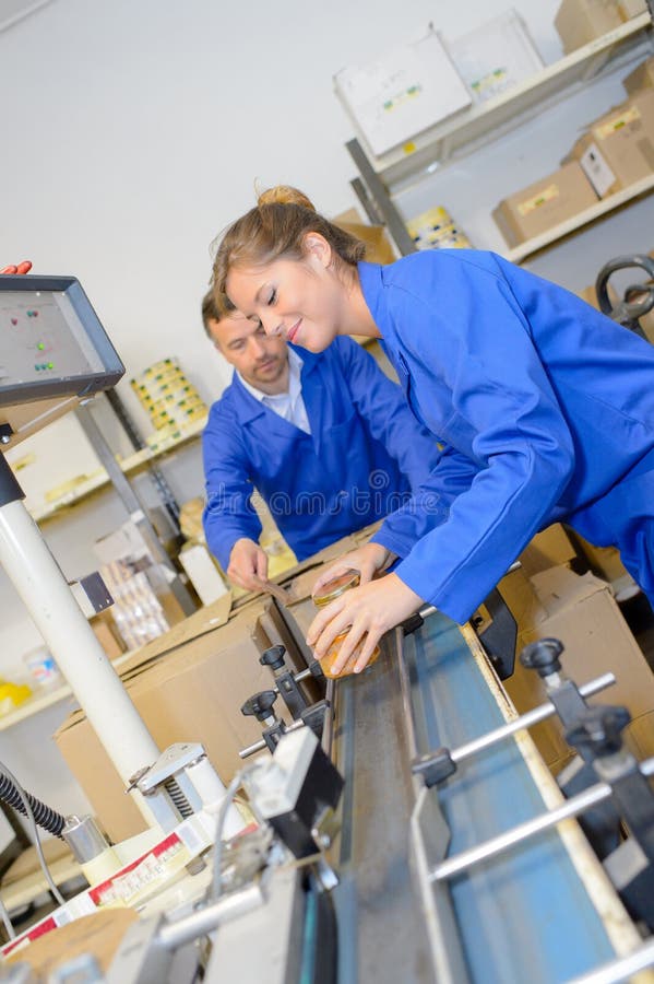 Workers Packing Parcels with Sticky Tape at Warehouse Stock Photo ...