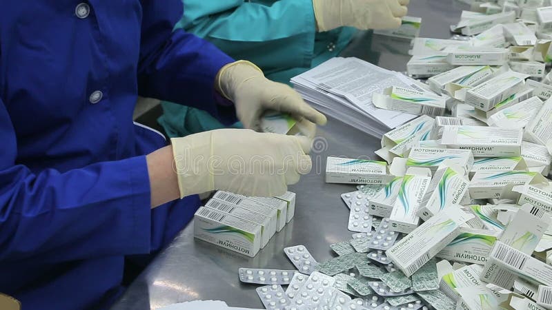 The Workers of the Pharmaceutical Factory Sort of Blisters Stock ...