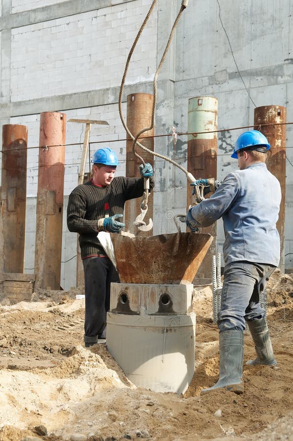 Workers at piling works stock photo. Image of action - 14026524