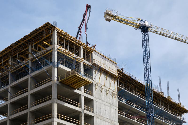 Workers Pour Concrete at the Construction Site of a New Residential ...