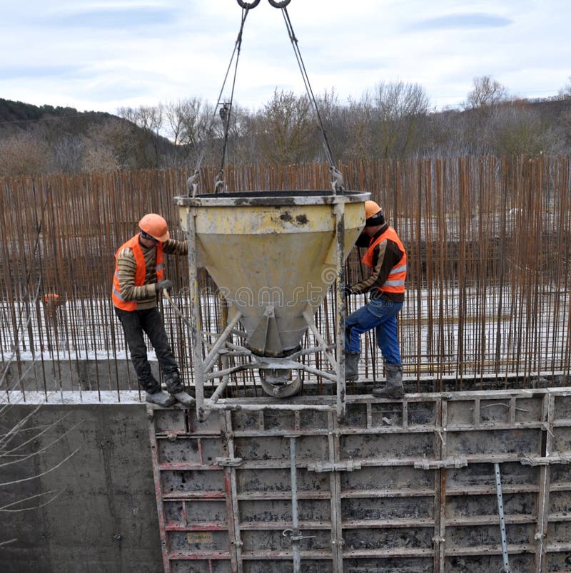 Workers Pour Concrete into the Formwork of the Wall Editorial Photo ... Workers Pour Concrete into the Formwork of the Wall Editorial Photo ...
