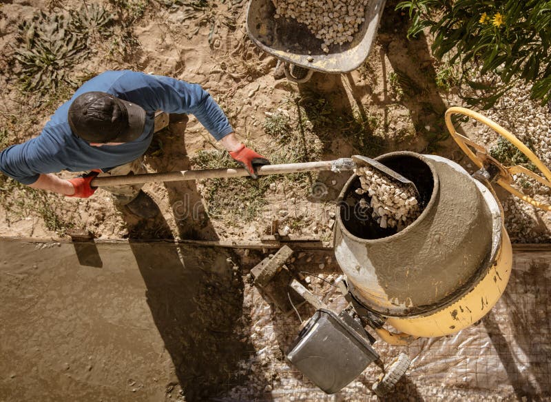 Workers Pour Concrete Solution at a Construction Site Stock Photo ...