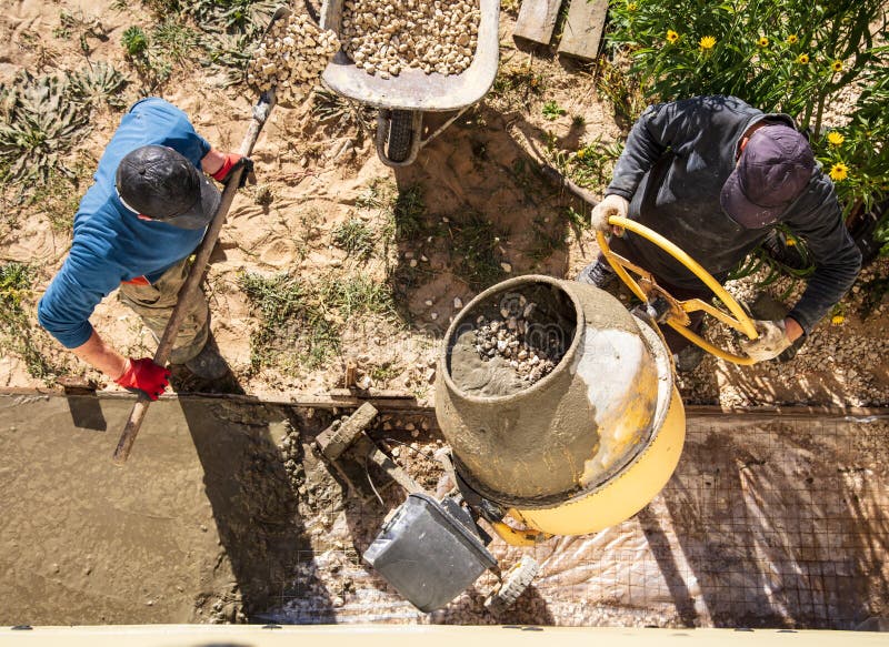 Workers Pour Concrete Solution at a Construction Site Stock Image ...