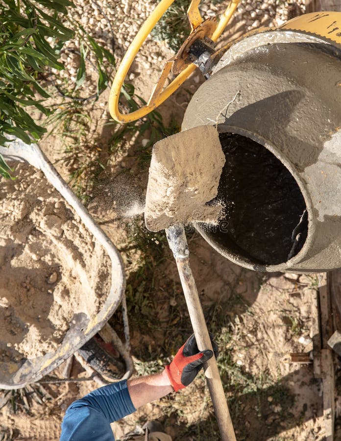 Workers Pour Concrete Solution at a Construction Site Stock Image ...