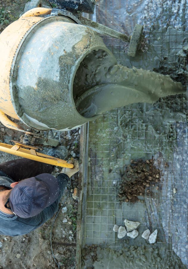 Workers Pour Concrete Solution at a Construction Site Stock Photo ...