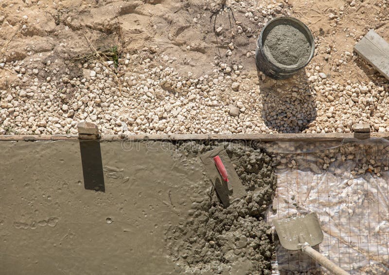 Workers Pour Concrete Solution at a Construction Site Stock Image ...