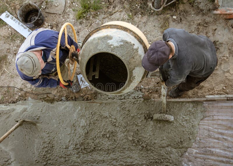 Workers Pour Concrete Solution at a Construction Site Stock Image ...