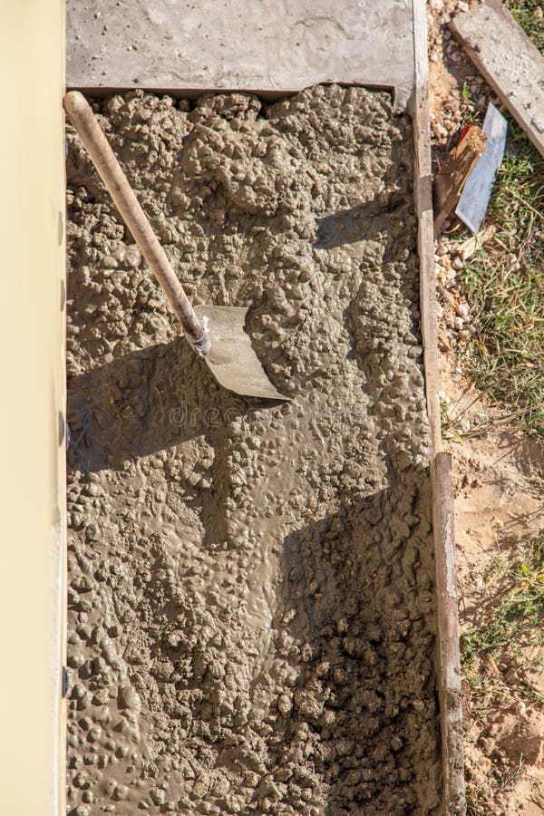 Workers Pour Concrete Solution at a Construction Site Stock Image ...