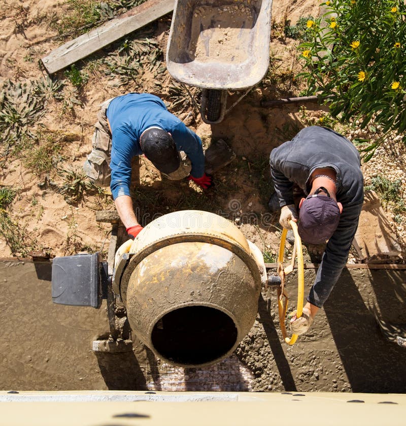 Workers Pour Concrete Solution at a Construction Site Stock Image ...